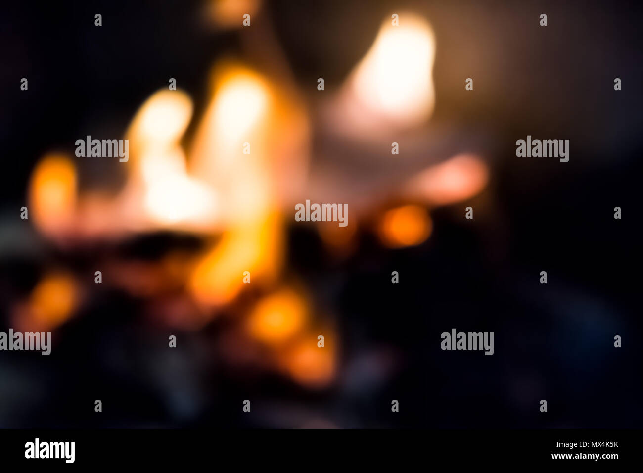 Abstract background of burning fire glow bokeh in indoor home interior ...