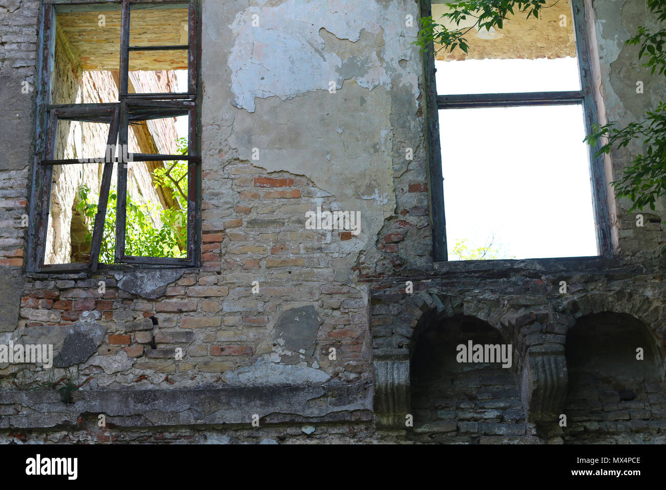 two old broken windows in castle Stock Photo - Alamy