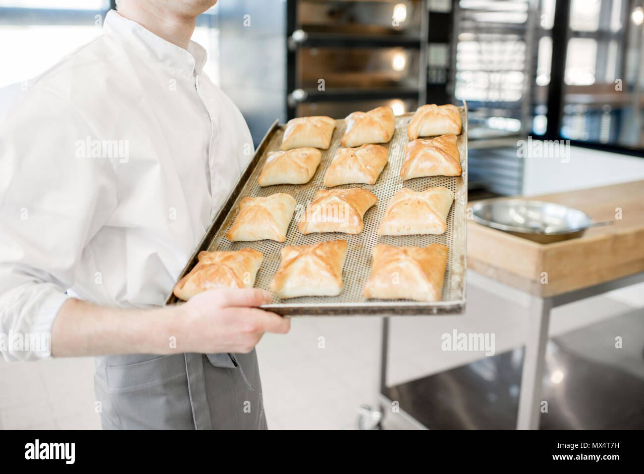 Man holding tray of bread hi-res stock photography and images - Alamy