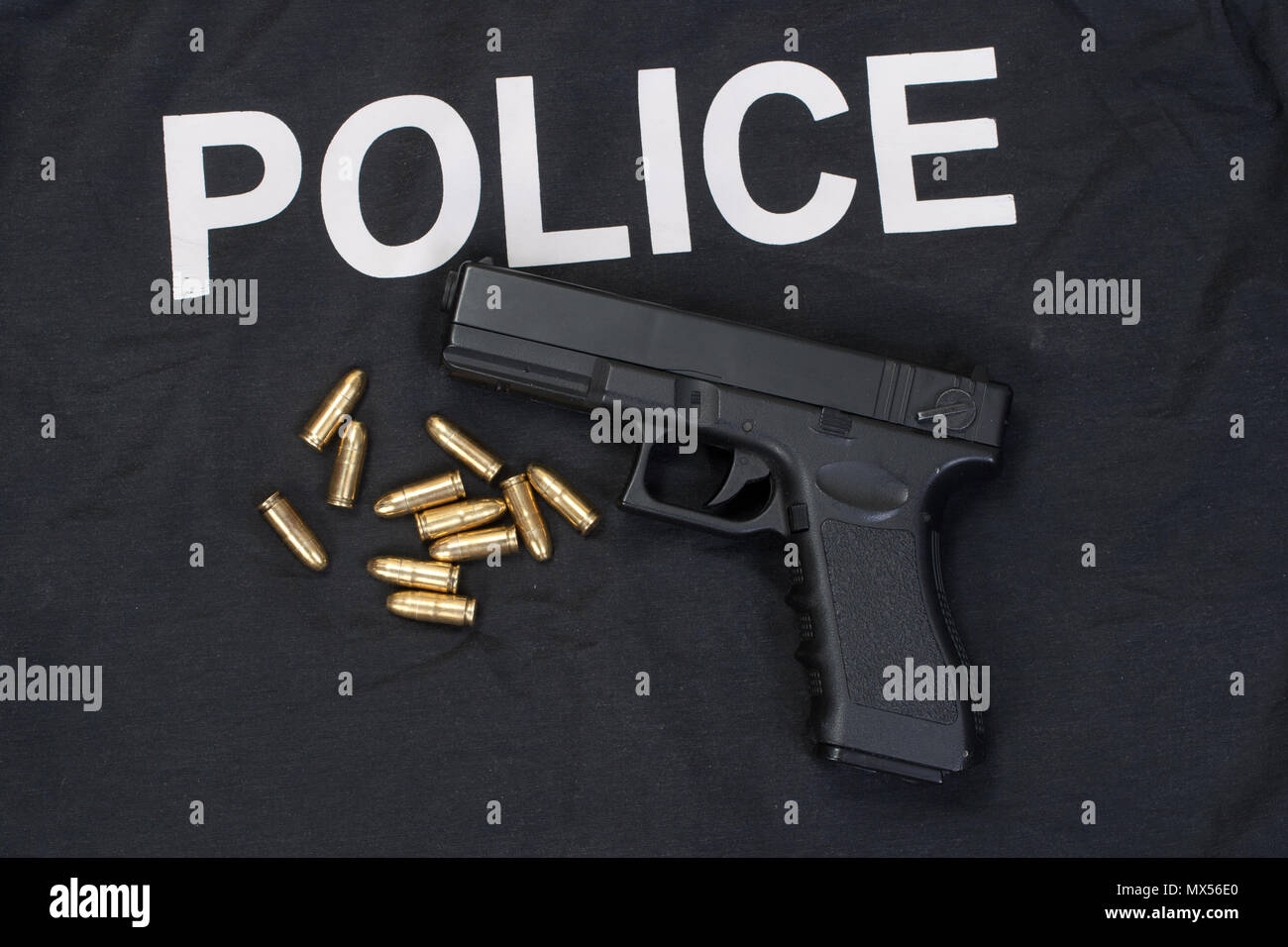 9mm handgun with ammo on police uniform Stock Photo - Alamy