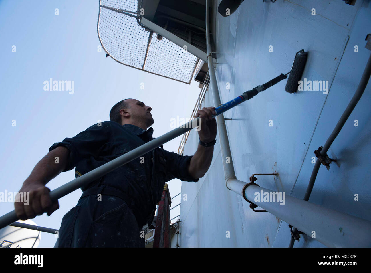 Va. (May 2, 2017) Seaman Danny Arato paints the hull of the aircraft ...