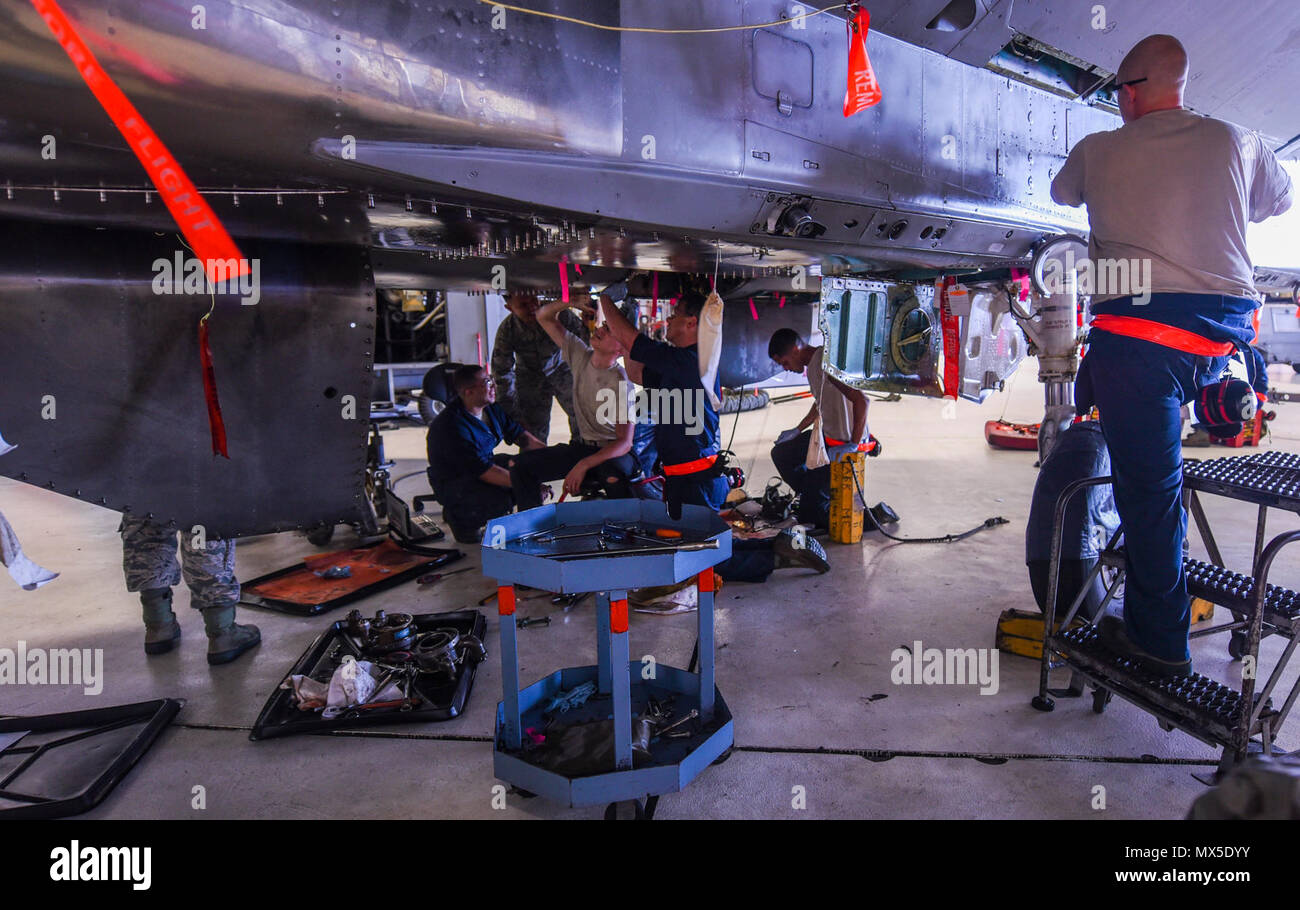 Members of the 67th Aircraft Maintenance Unit work on an F-15C Eagle in ...