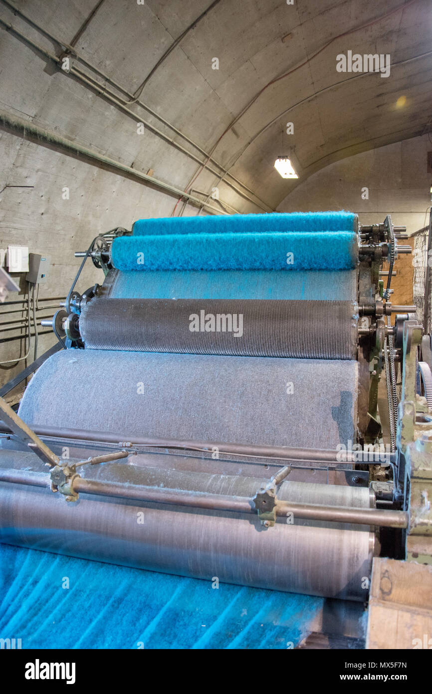 Wool carding; brushing of wool fibres with wire teeth to align the ...