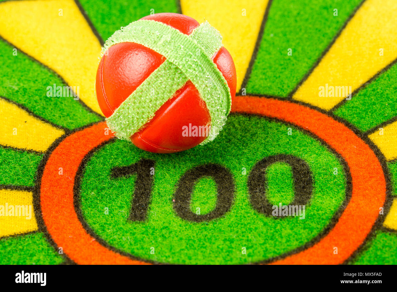red ball in the middle of dartboard target Stock Photo - Alamy