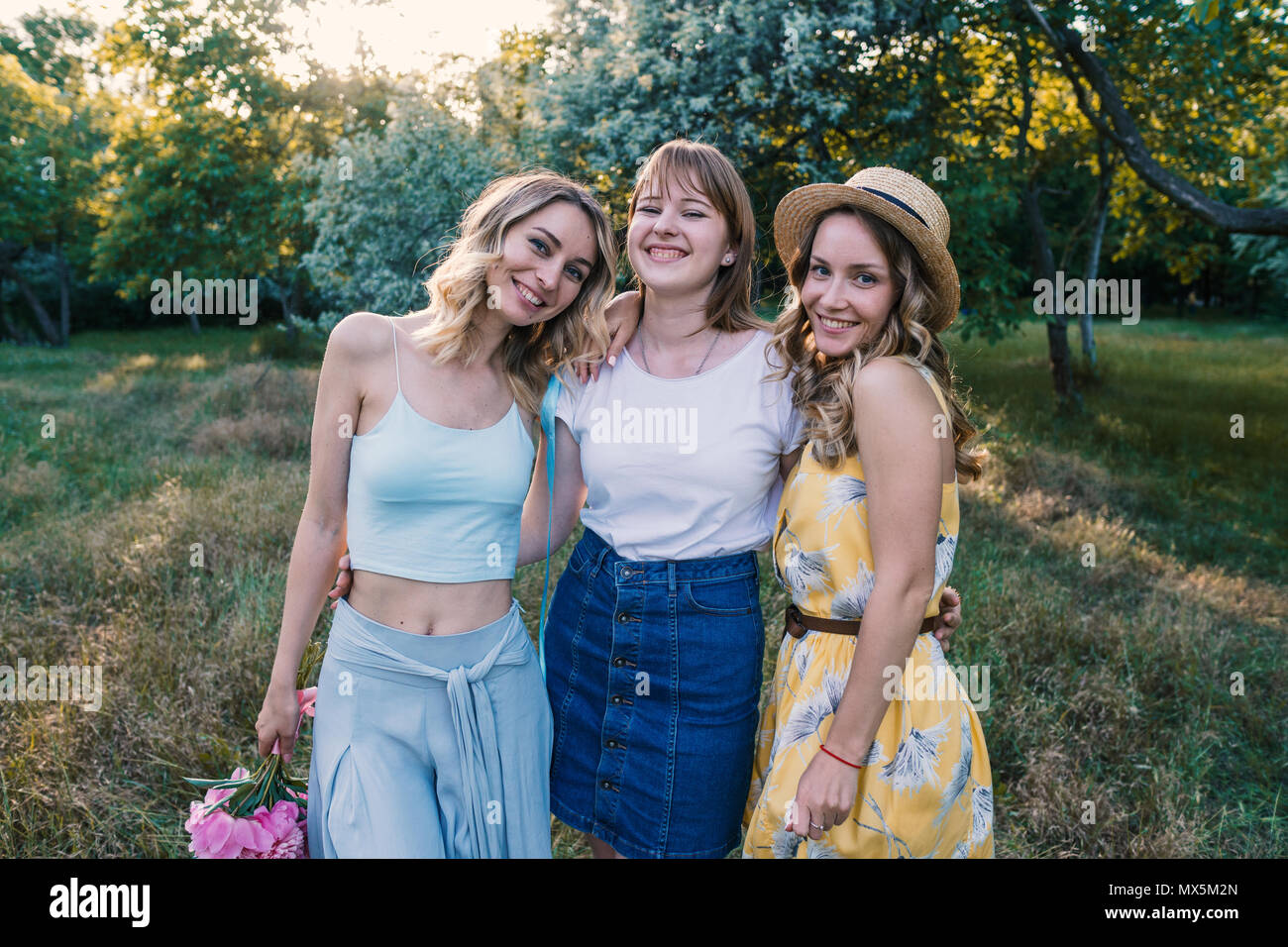 Three girls playing outdoor hi-res stock photography and images - Alamy