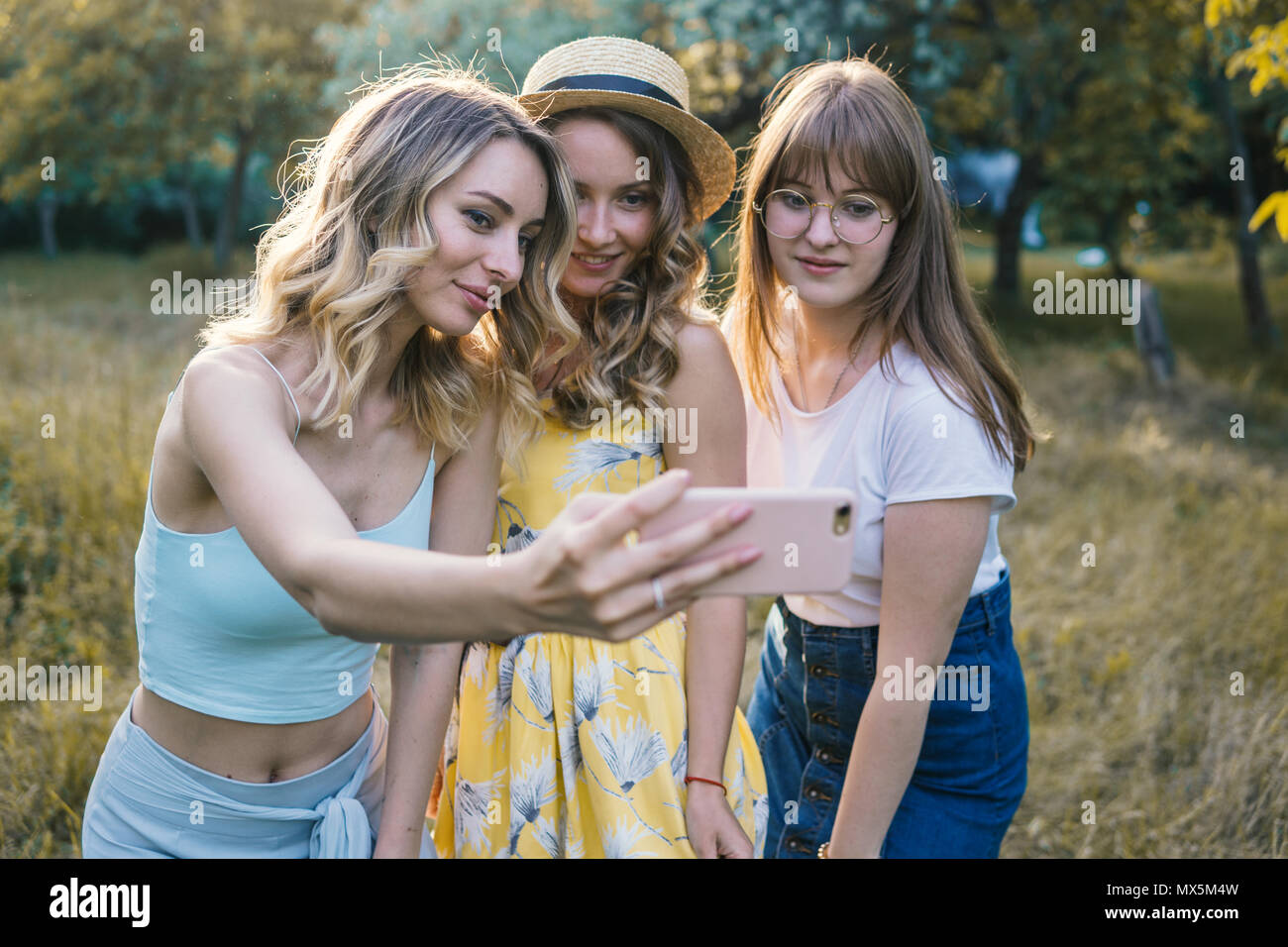 Group of girls friends take selfie photo Stock Photo - Alamy