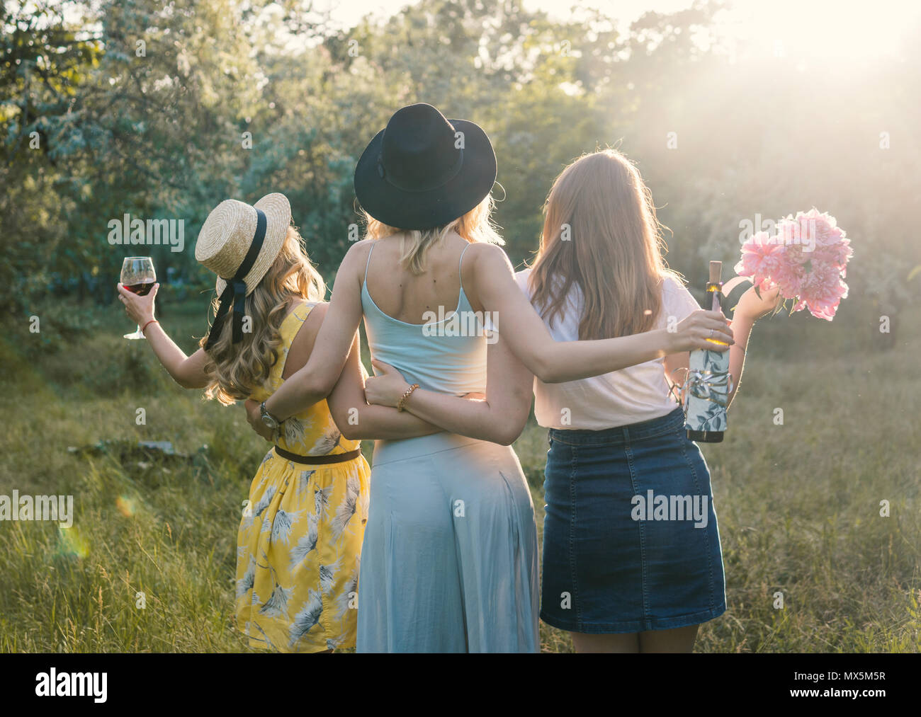 Group of girls friends making picnic outdoor. They have fun Stock Photo ...