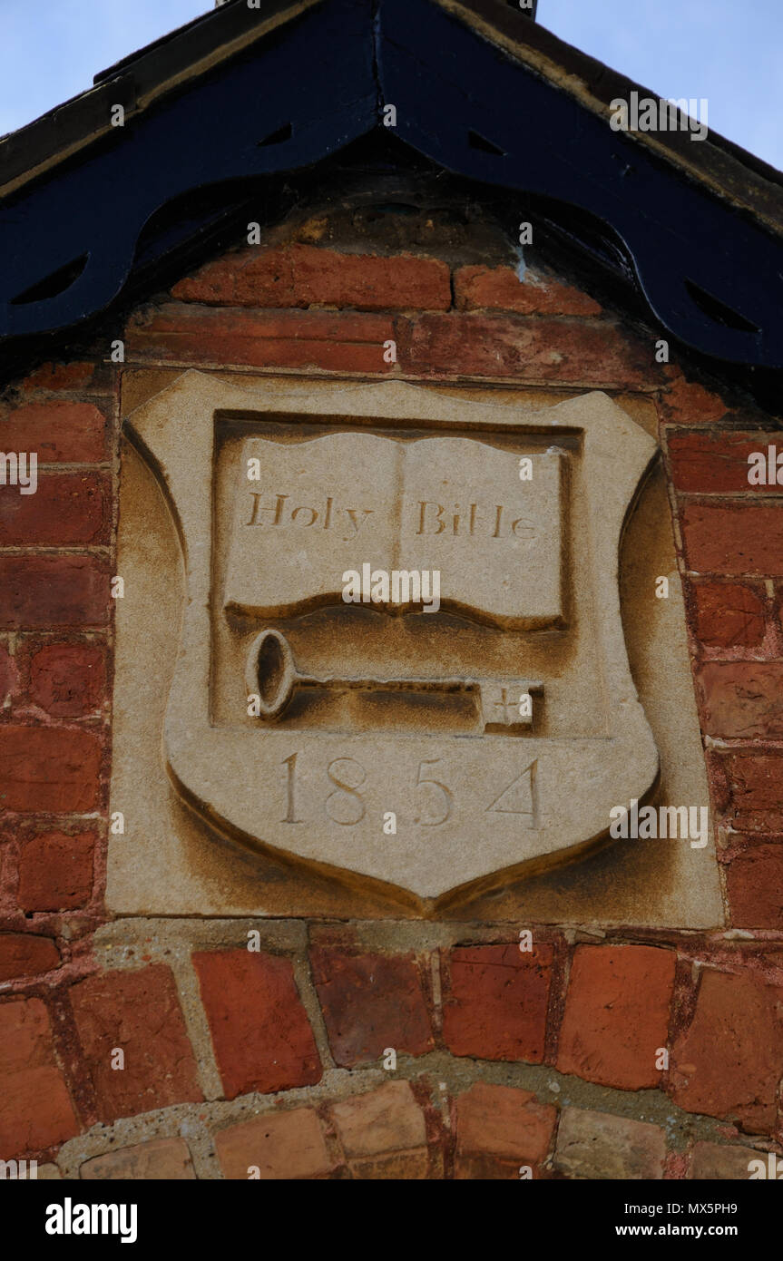Holy Bible, Key, and 1854 carved in stone on “The Old School”, Main ...