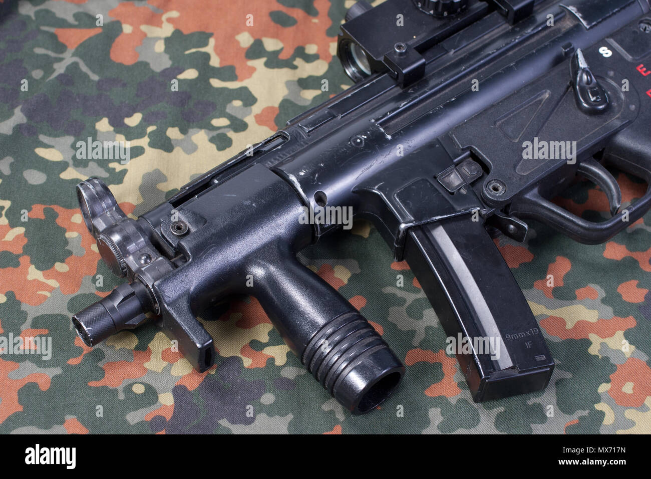 german modern submachine gun MP5 on camouflaged background Stock Photo ...