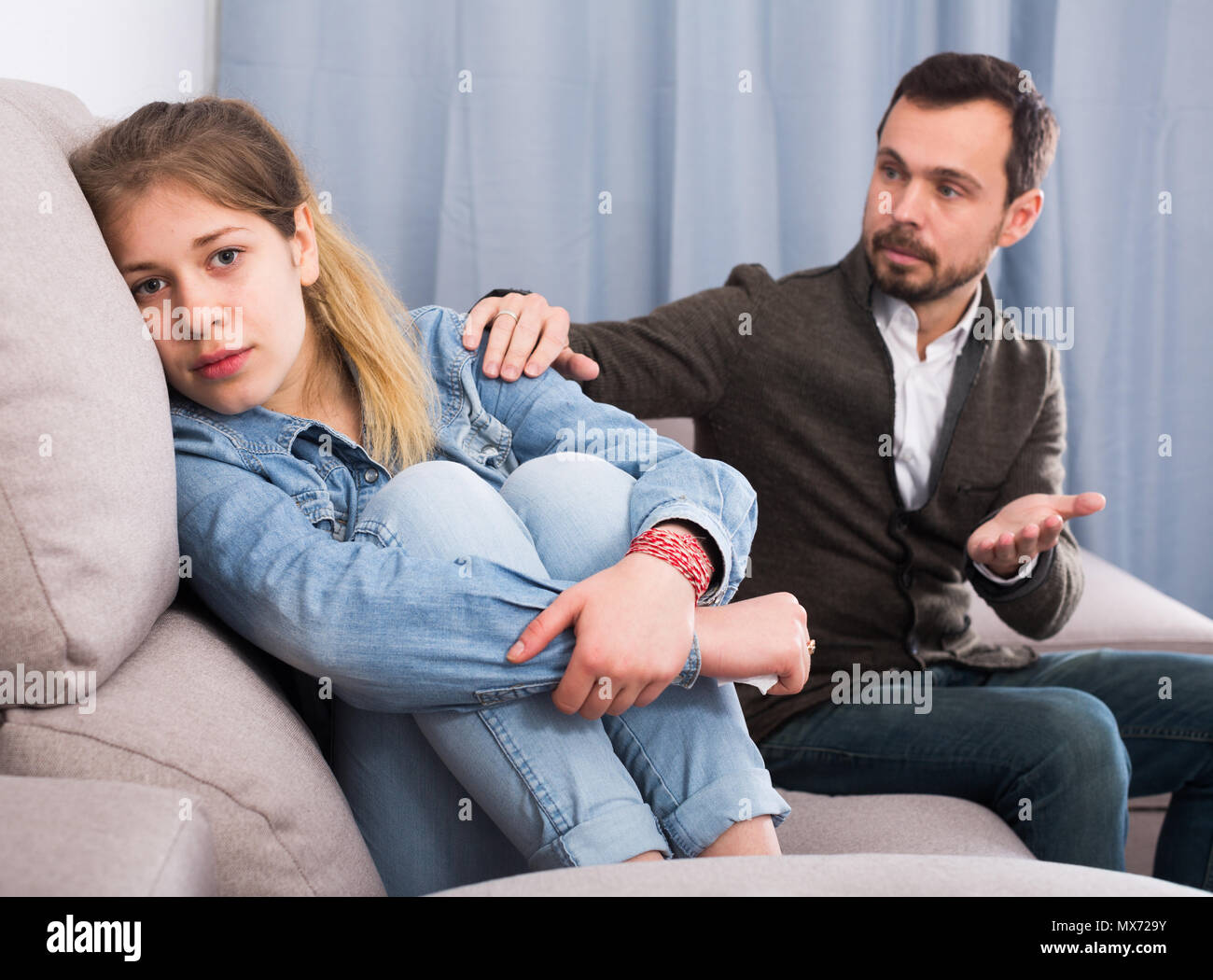 Young father quarrelling with his daughter teenager at home Stock Photo ...