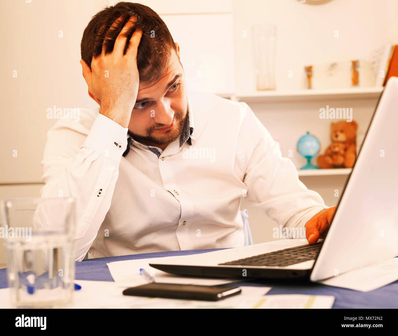 Male employee having complicated issue in project in office Stock Photo ...