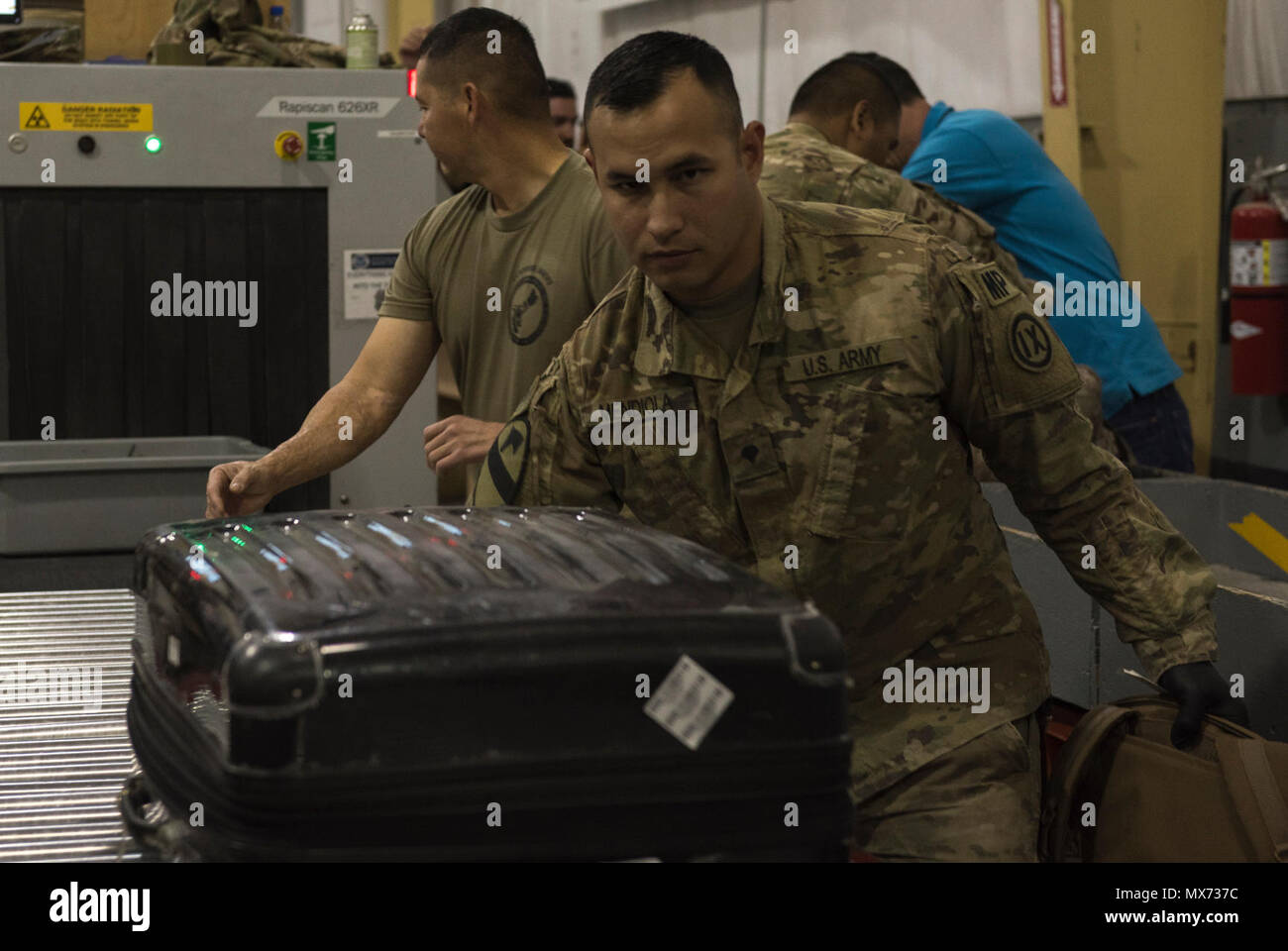 U.S. Army Spc. Adam Mendiola, 368th Military Police Company, pushes a ...