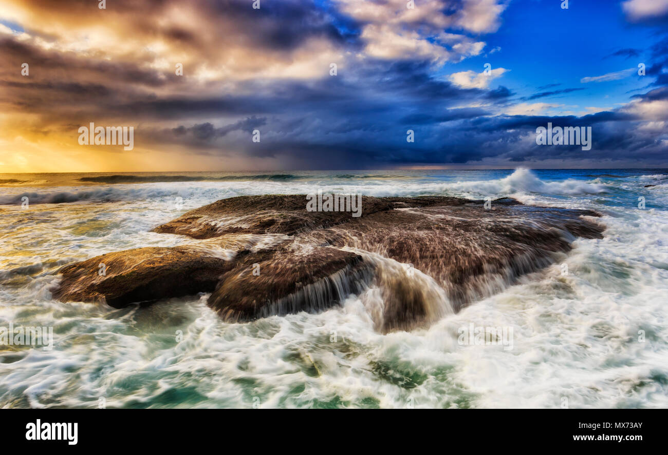 Sandstone rocky boulder at Bungan beach on Sydney northern beaches ...