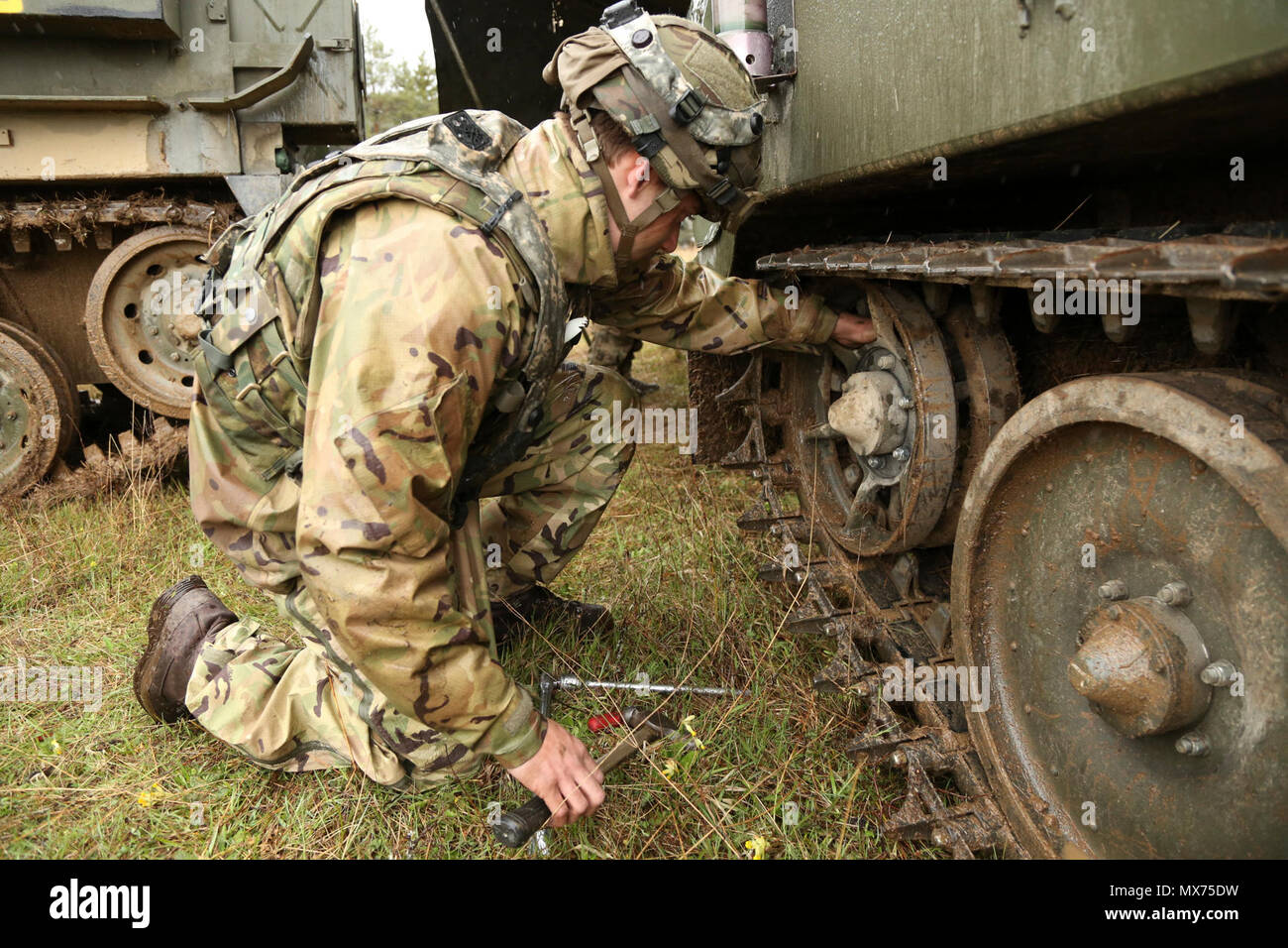 British soldier Nico Bowen of the Queens Royal Hussars repairs a ...