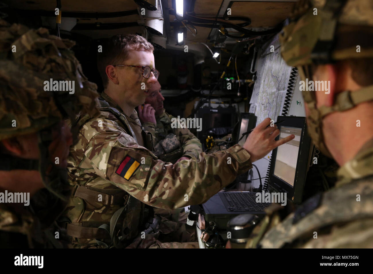 British Army 2nd Lt. David Cahill, center, of the 1st Armored Medical ...