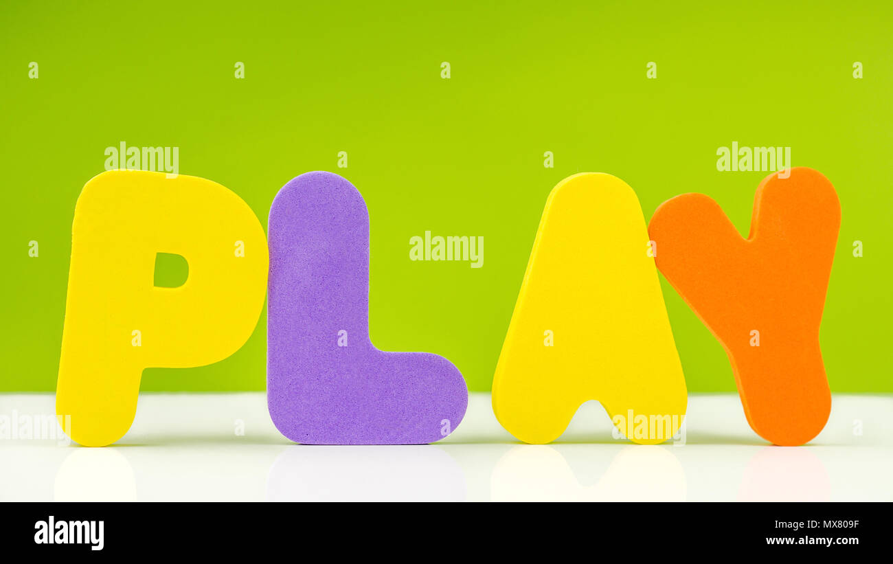 playing with words on green and white background Stock Photo - Alamy
