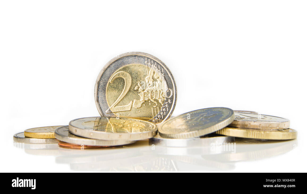 standing two euro coin on white background with some other coins Stock ...