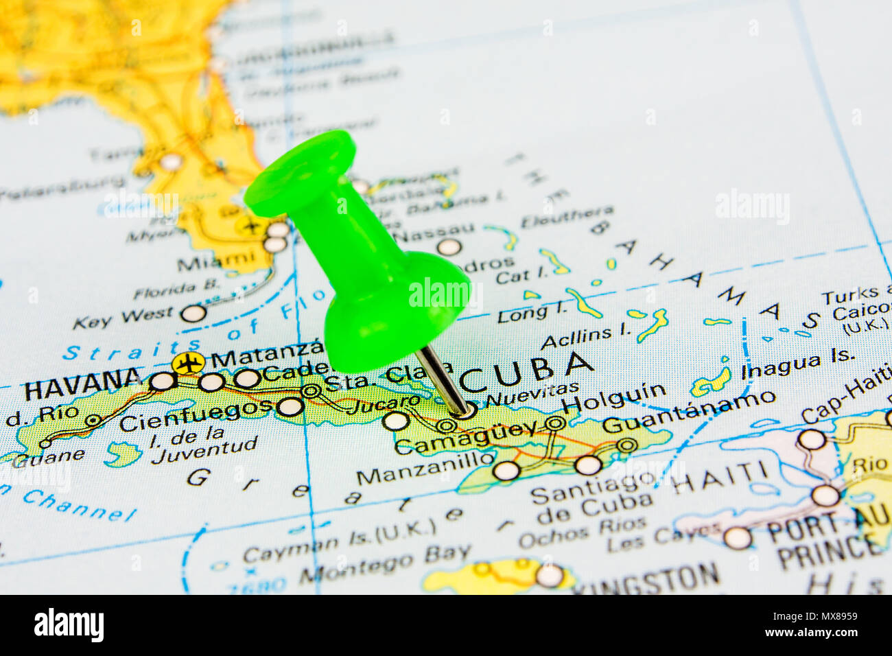 Draw-pin stick into real map, identification of final destination, Cuba ...