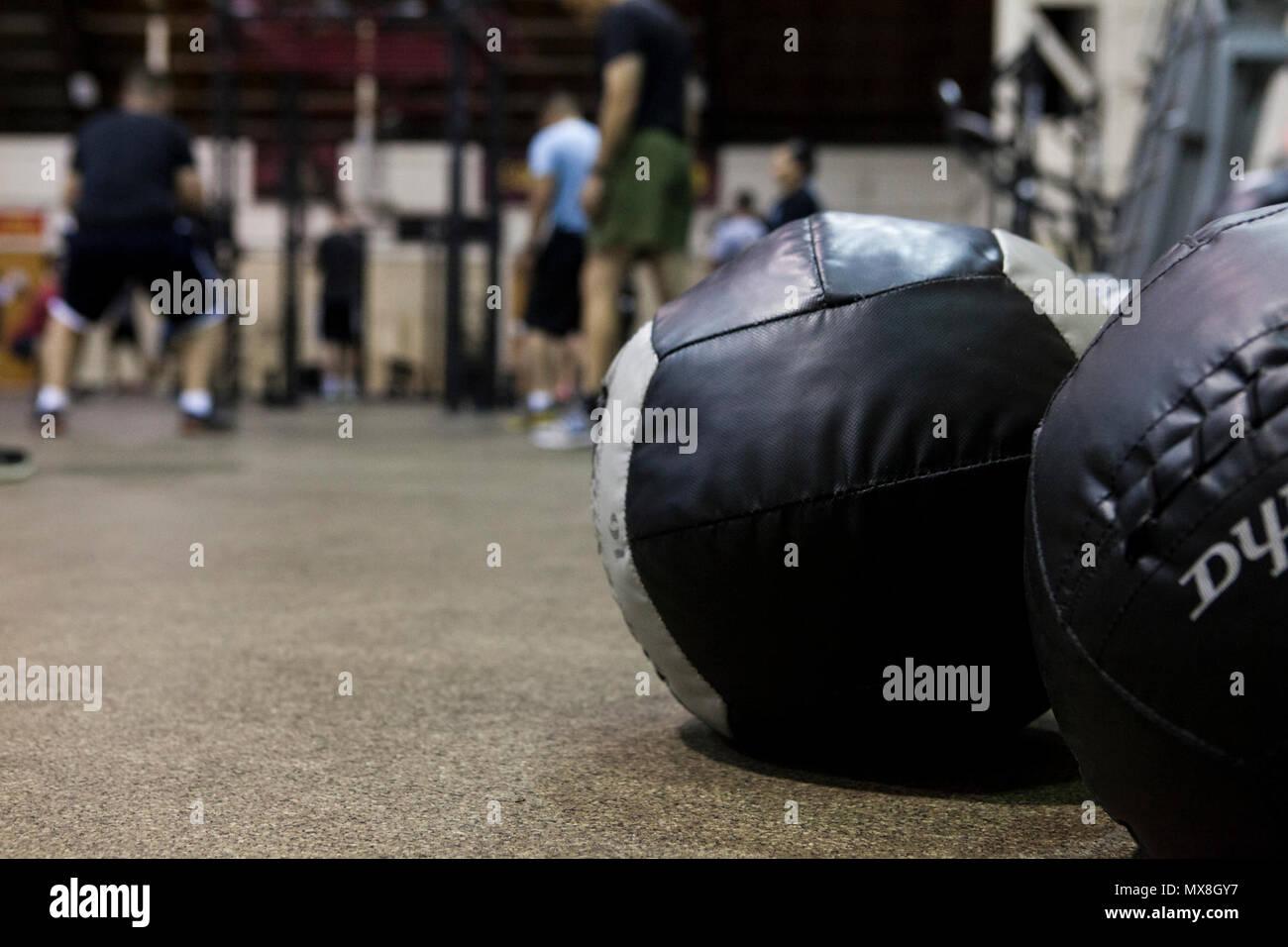 A set of medicine balls are staged for a High Intensity Tactical ...