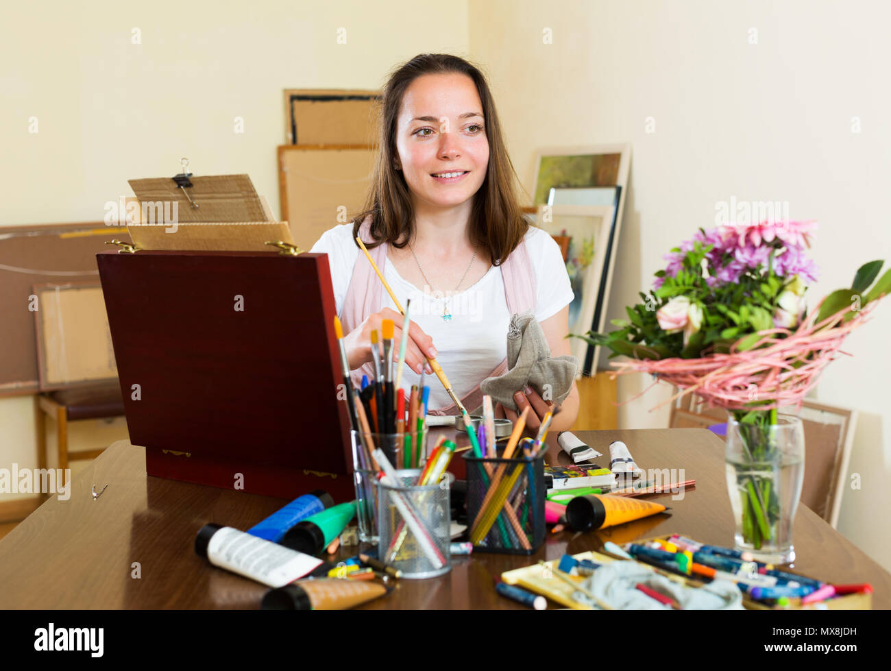 Attractive artist in the process of creating a new picture Stock Photo ...