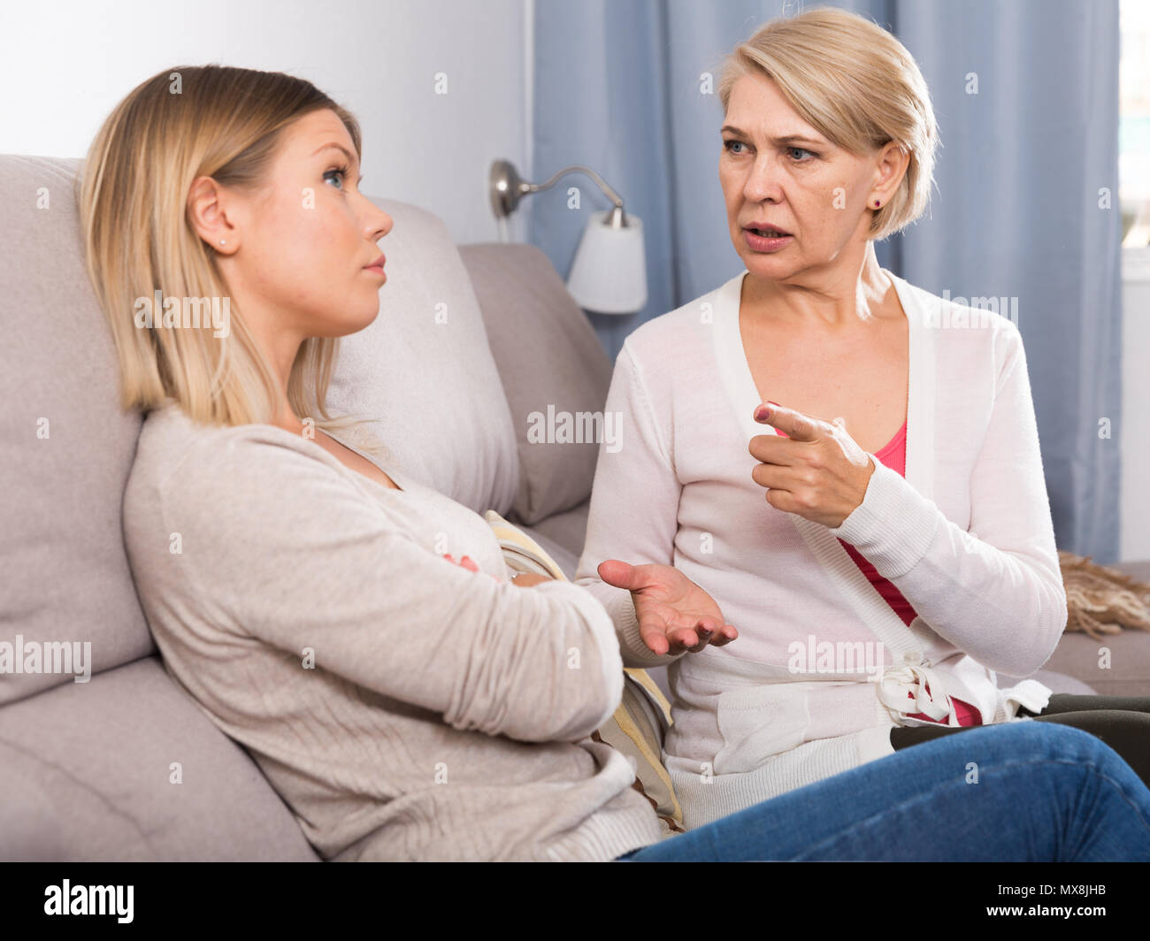 Angry mother scolds her adult sad daughter Stock Photo - Alamy