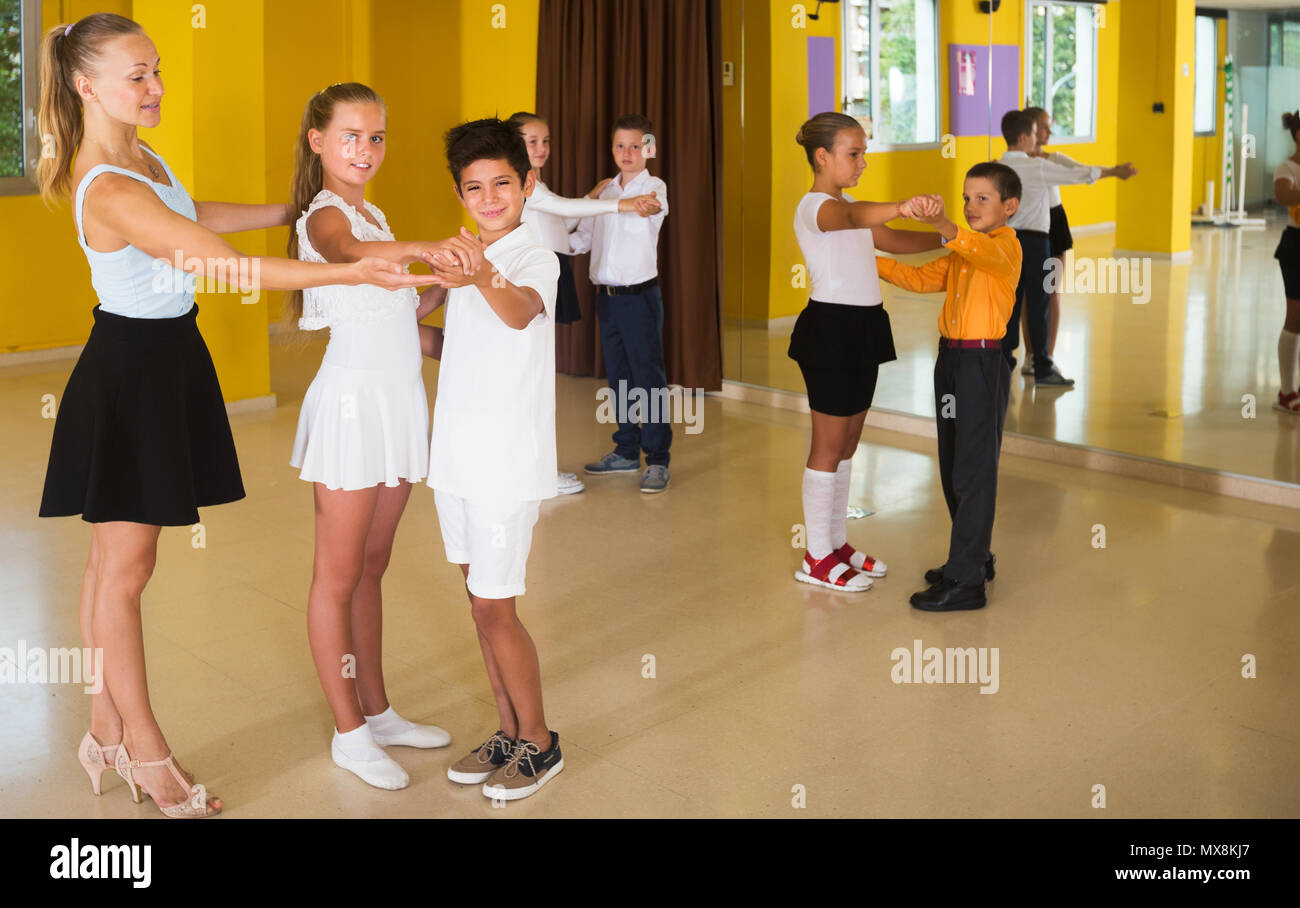 Children in dance studio learning new movements, smiling and having fun ...