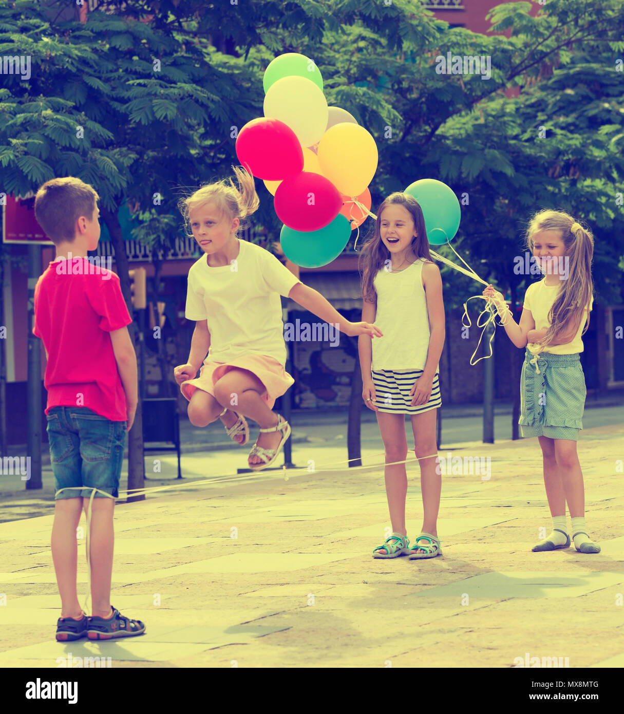 Chinese play skipping rope hi-res stock photography and images - Alamy