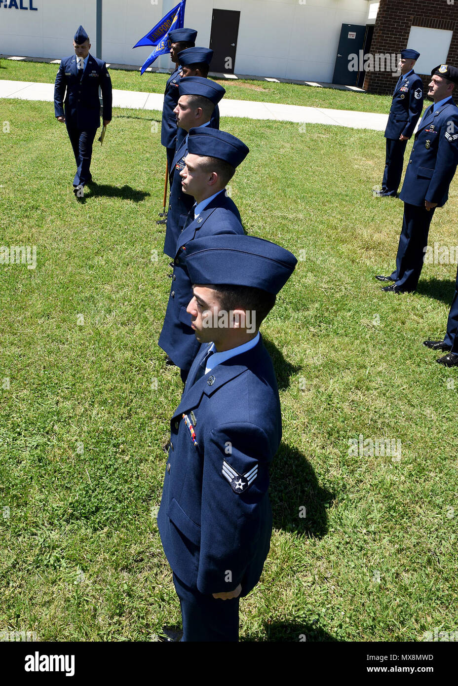 Airman leadership school students in Class 17-5 stand outdoors for an ...