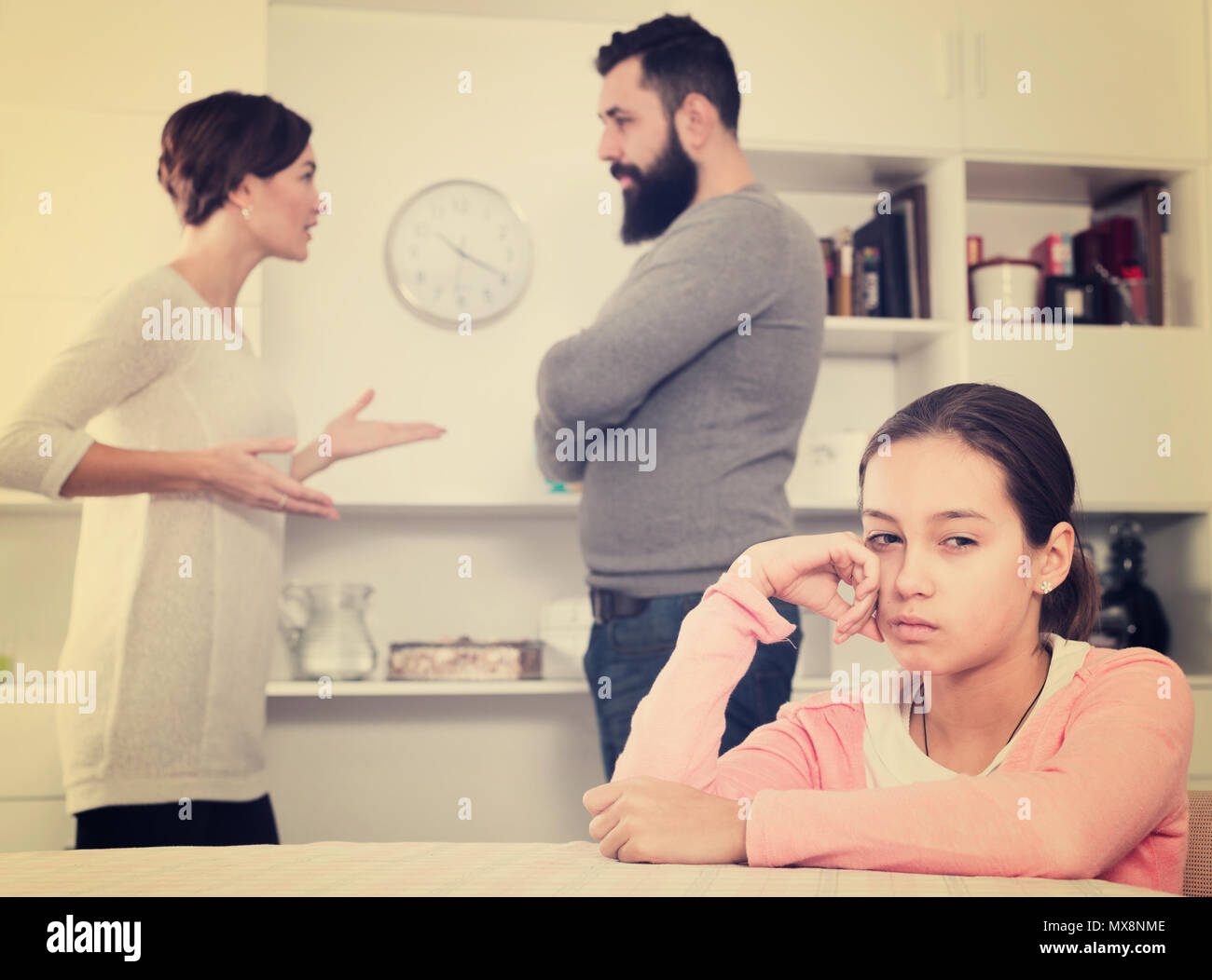 Parents arguing with teenager listening hi-res stock photography and ...