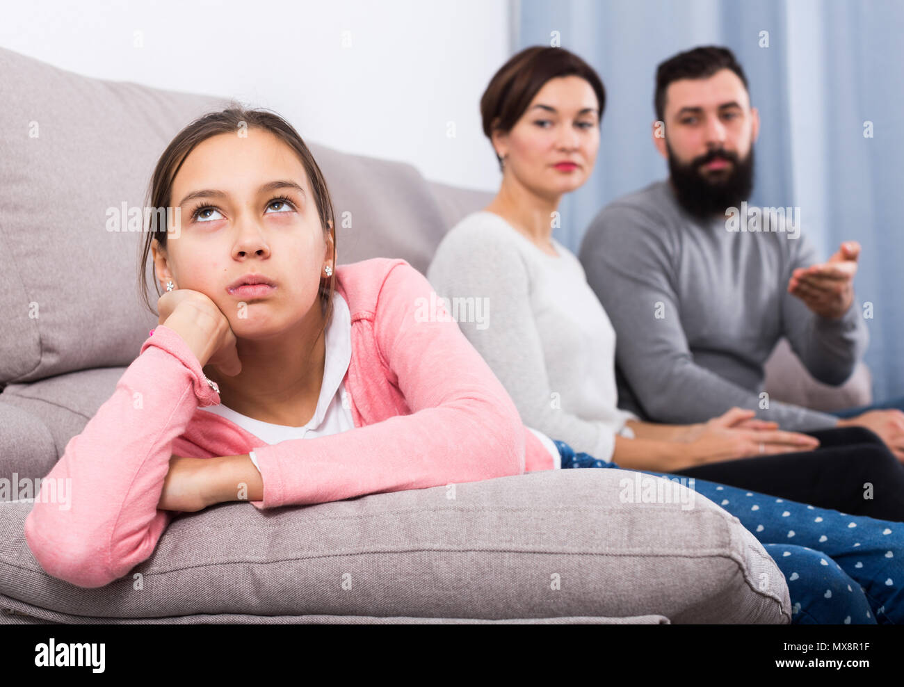 Young father and mother correcting their child for disobedience Stock ...
