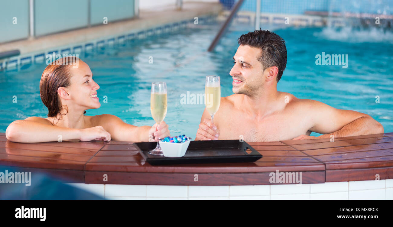 Romantic couple is relaxing with glasses of vine in spa-salon Stock ...