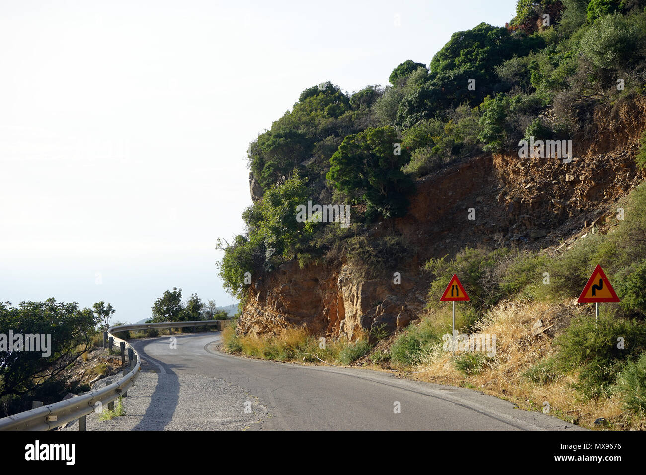 Road signs and asphalt road on the west coast of Krete, Greece Stock ...