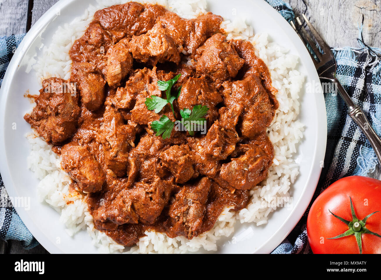 Chicken tikka masala served with rice in a white plate. Top view Stock ...
