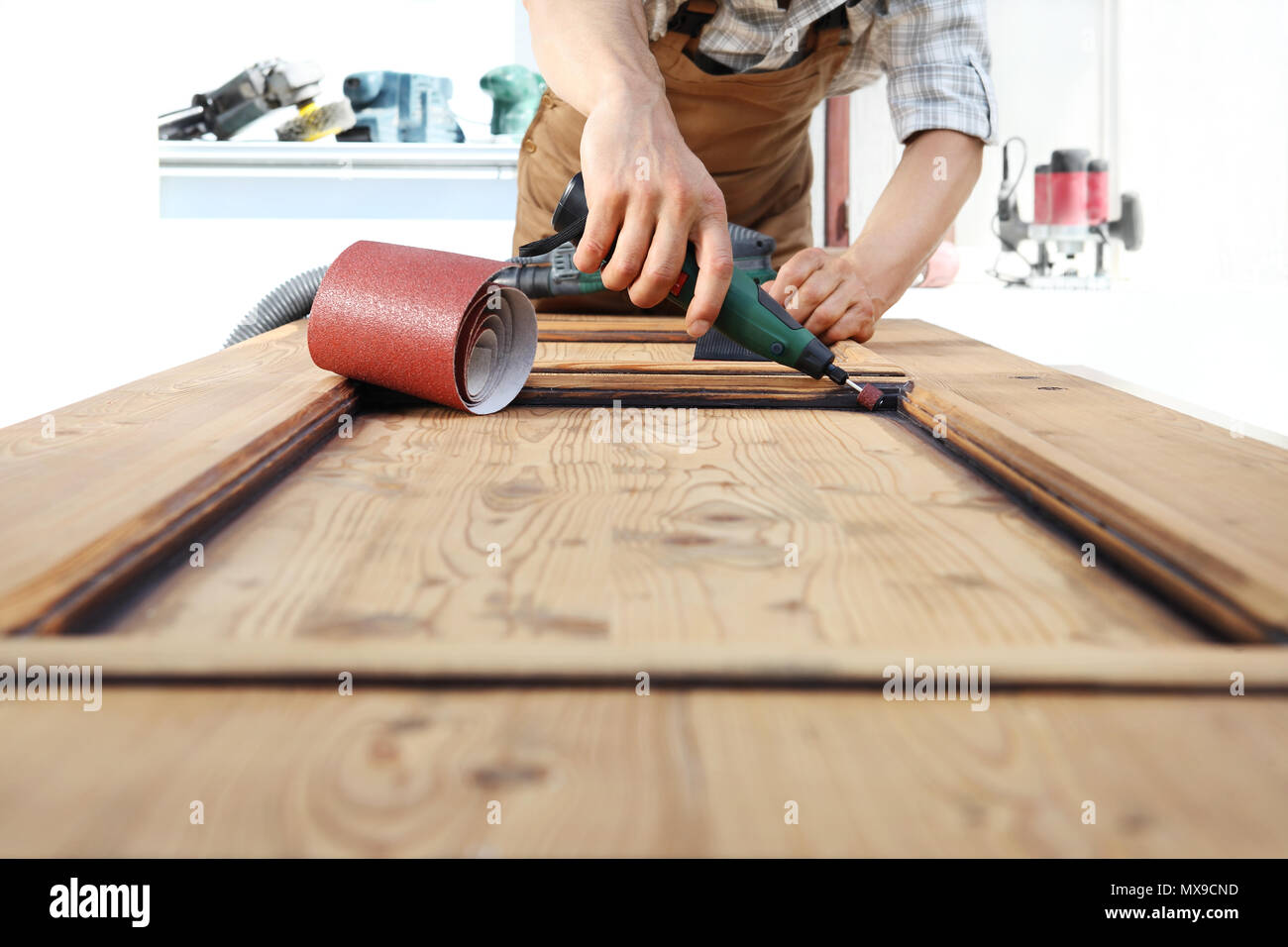 carpenter work the wood with the rotary tool Stock Photo - Alamy