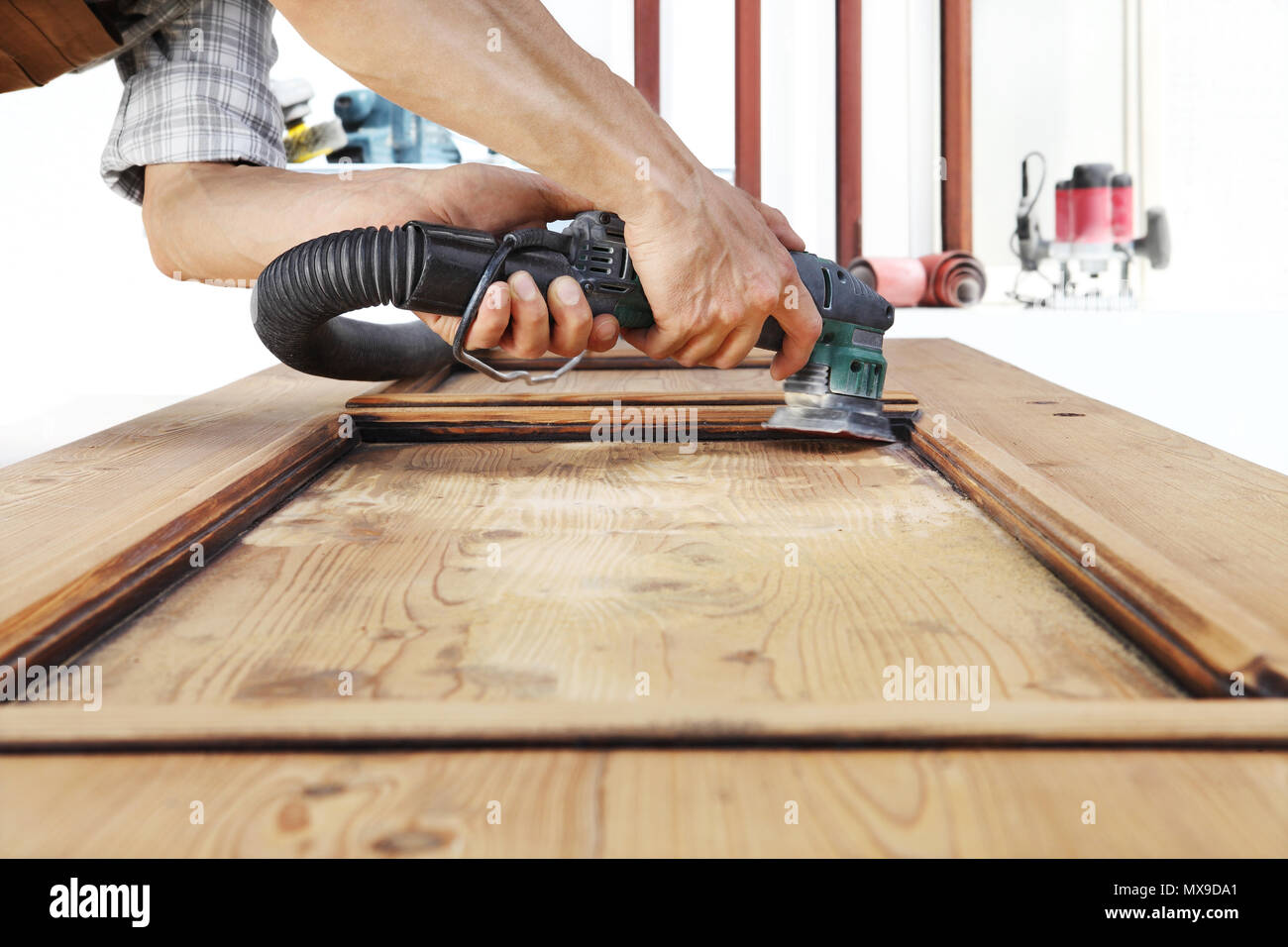 carpenter work the wood with the sander Stock Photo - Alamy