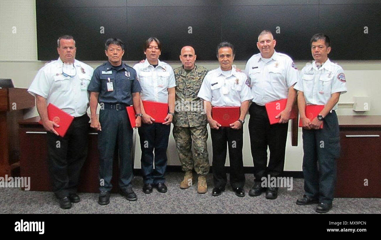 CAMP FOSTER, OKINAWA, Japan –Firefighters pose for a picture with Maj ...