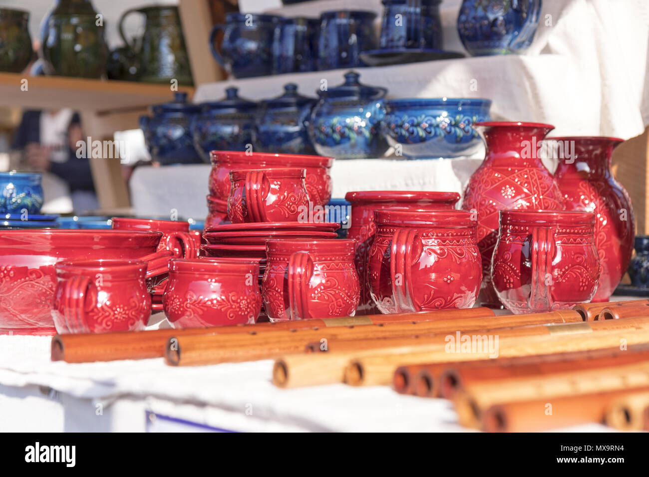 Ceramic mugs and pots, wooden whistles, wooden musical instruments ...