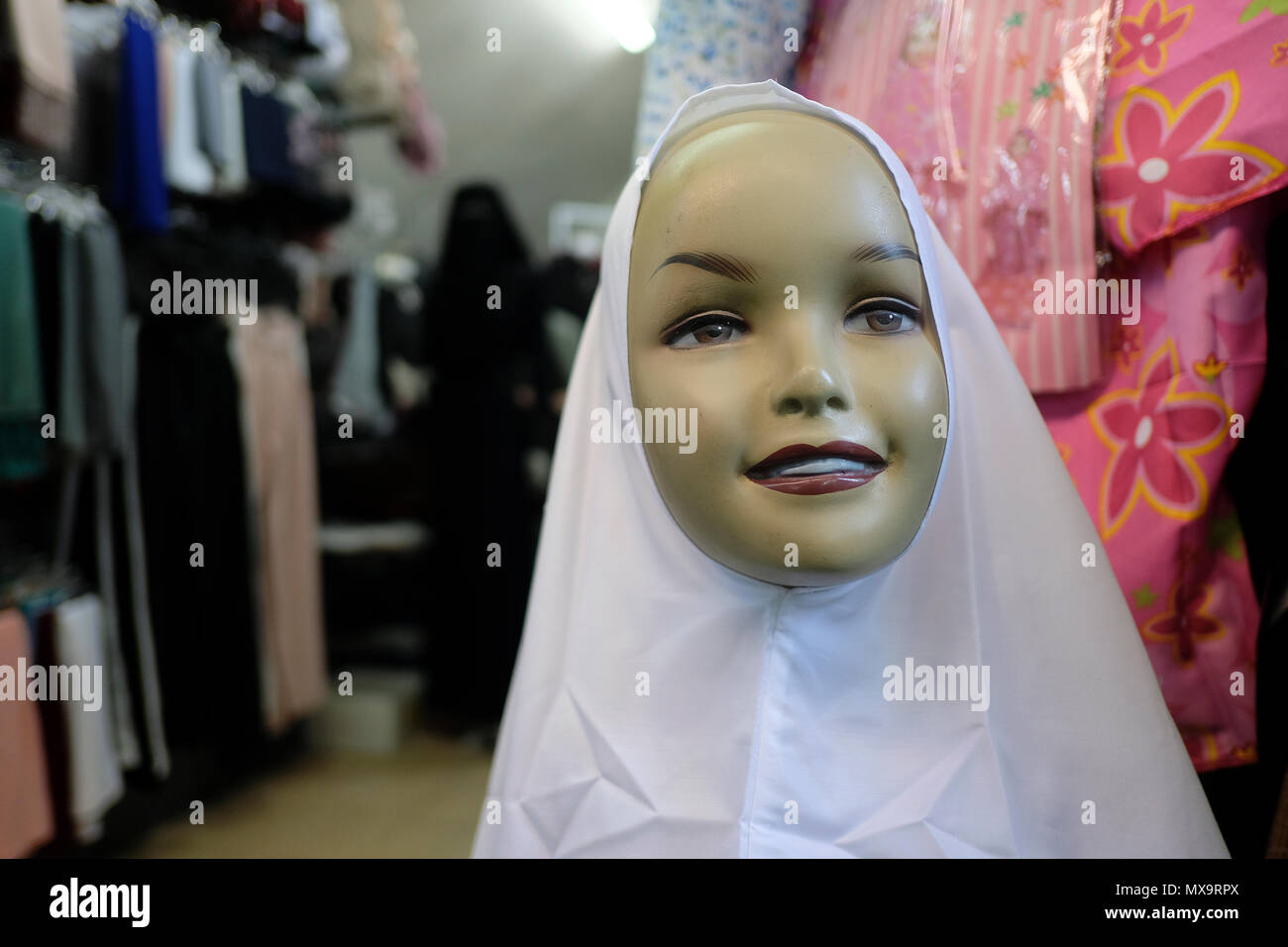 Mannequin displays traditional Hijab head scarf in a clothing shop at ...