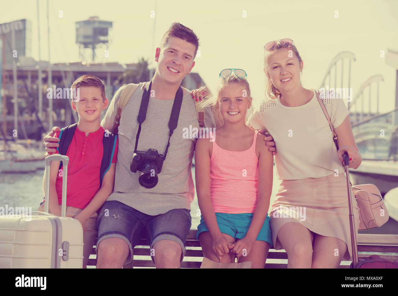 Young parents with kids travelling together enjoying vacations in city ...