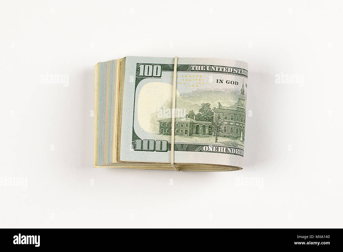 100 dollar bill roll isolated on white background Stock Photo - Alamy