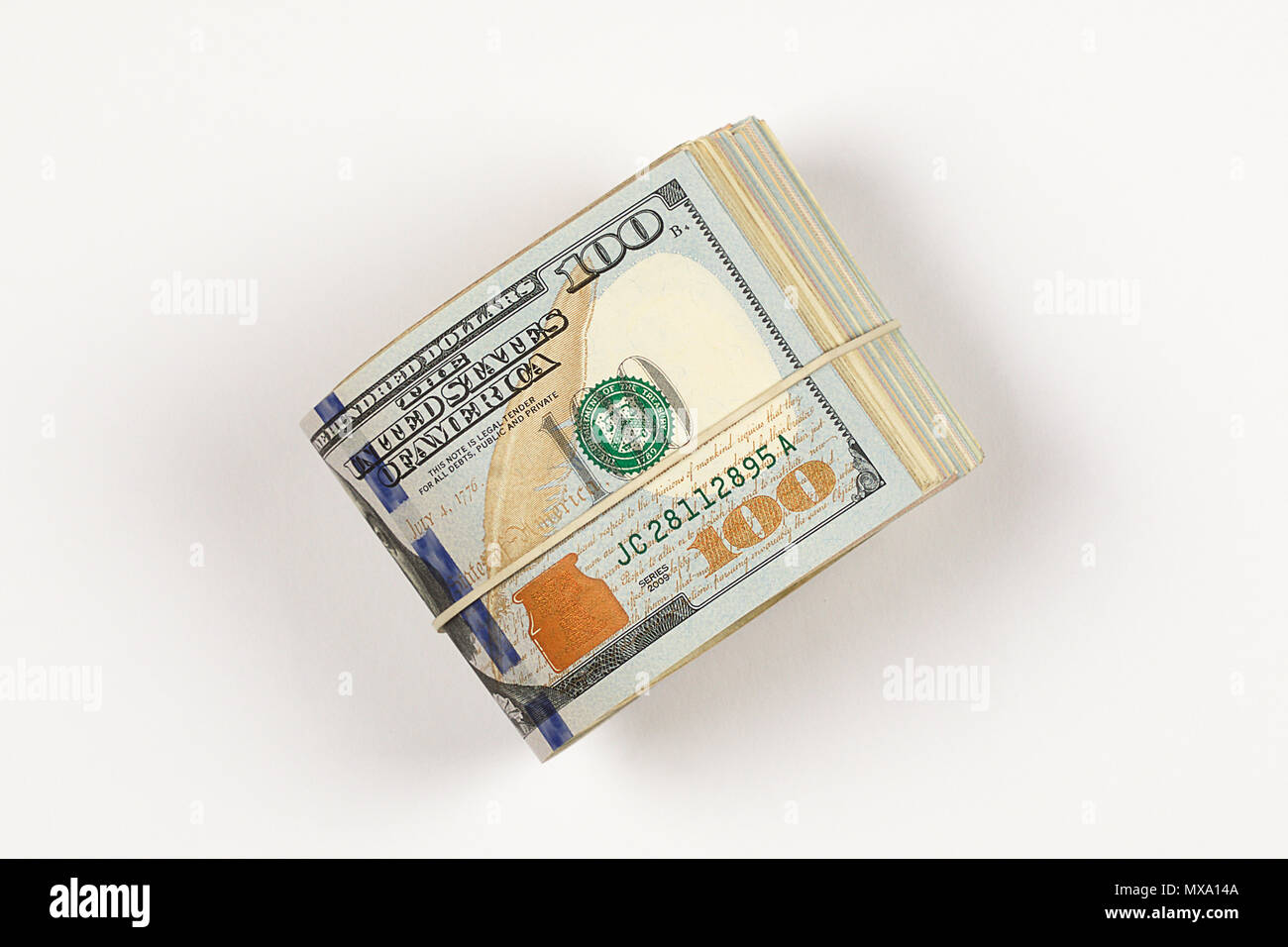 100 dollar bill roll isolated on white background Stock Photo - Alamy