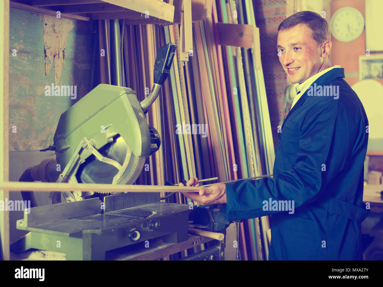 portrait of happy russian man in uniform working on electrical rotary ...