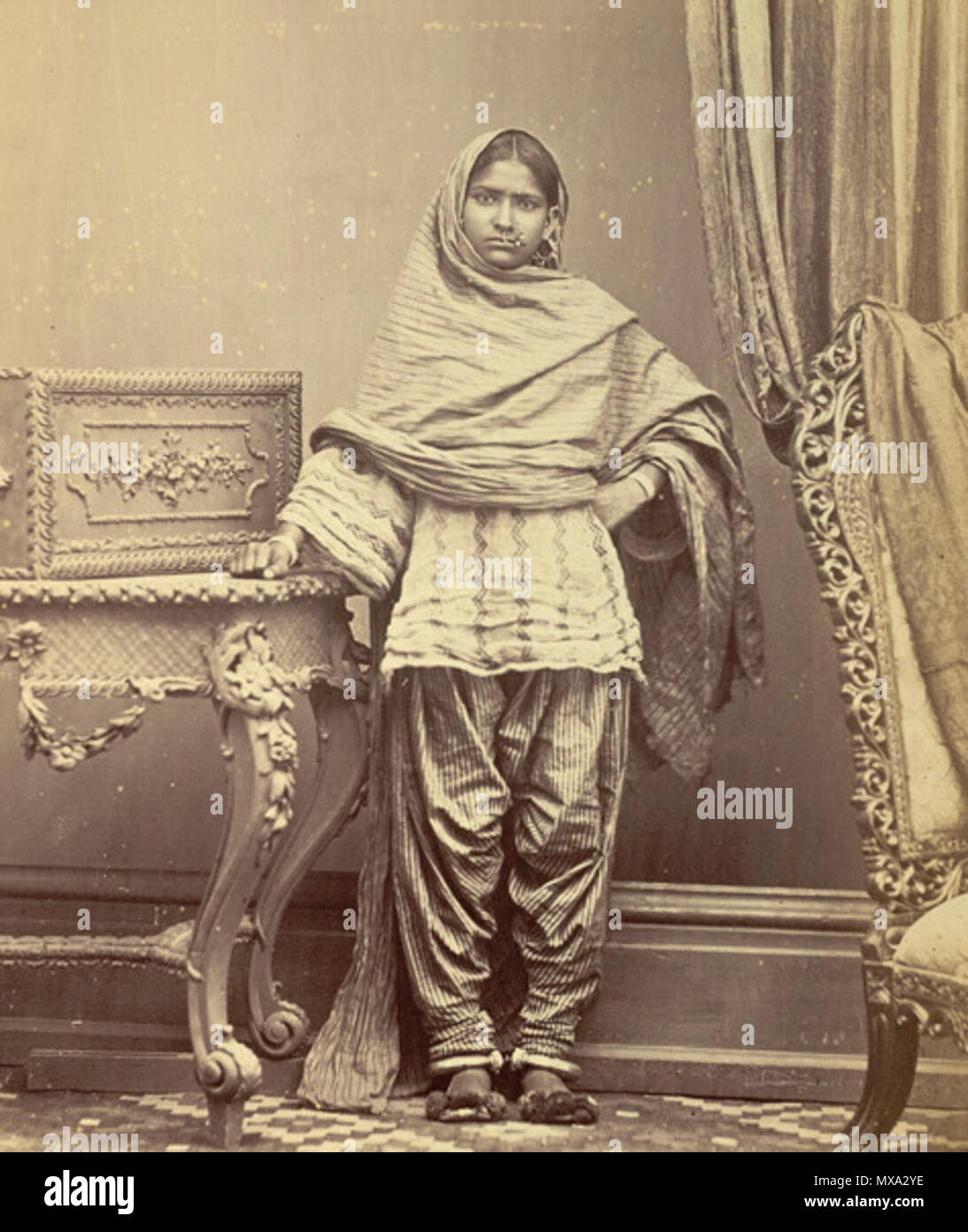 . Portrait of a Muslim girl from Sindh, showing method of wearing ear ...