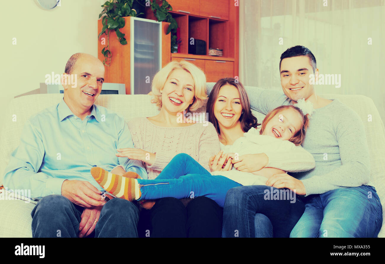 Long family with grand children posing indoors Stock Photo - Alamy