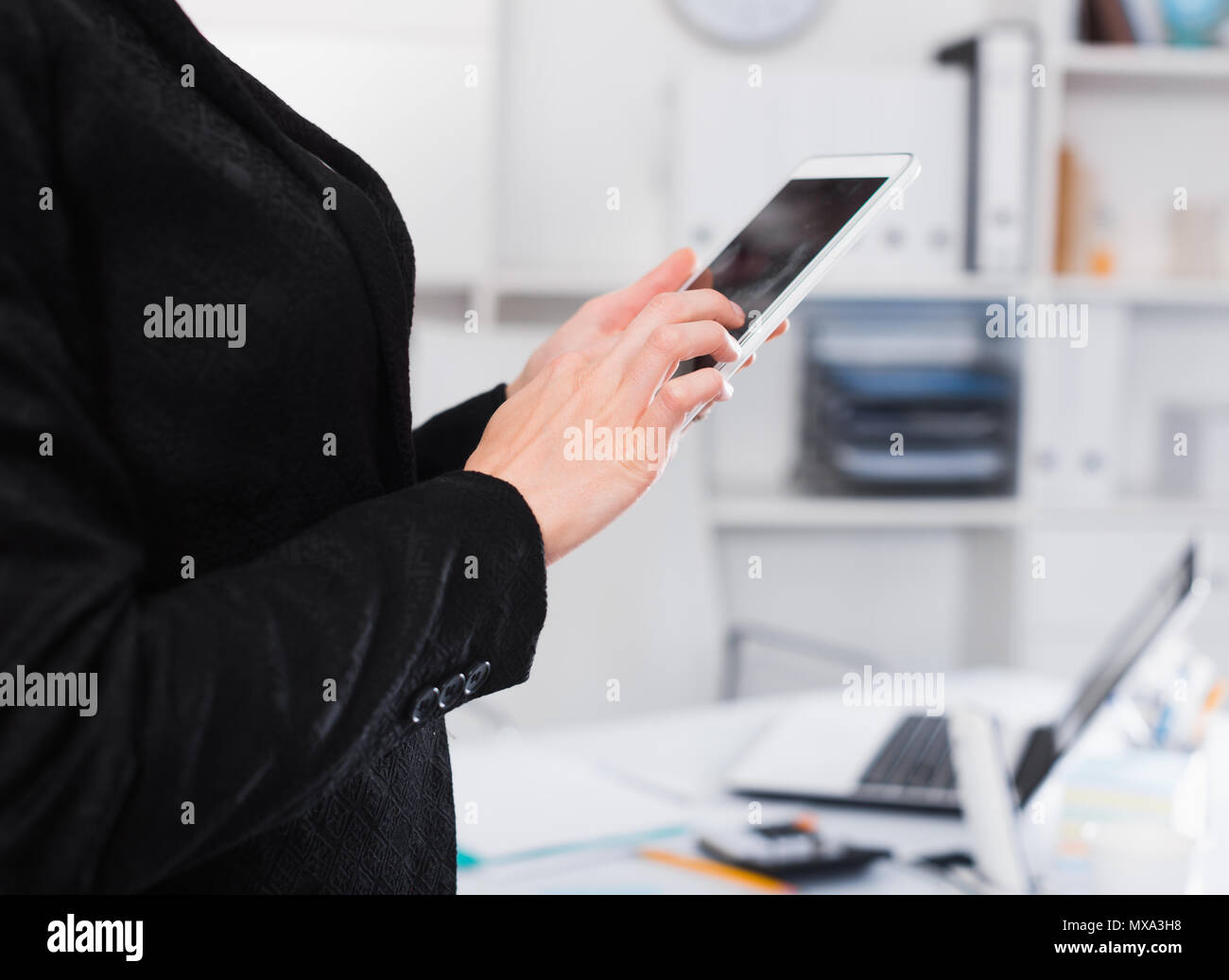 Young woman working and touching screen in the offic Stock Photo - Alamy