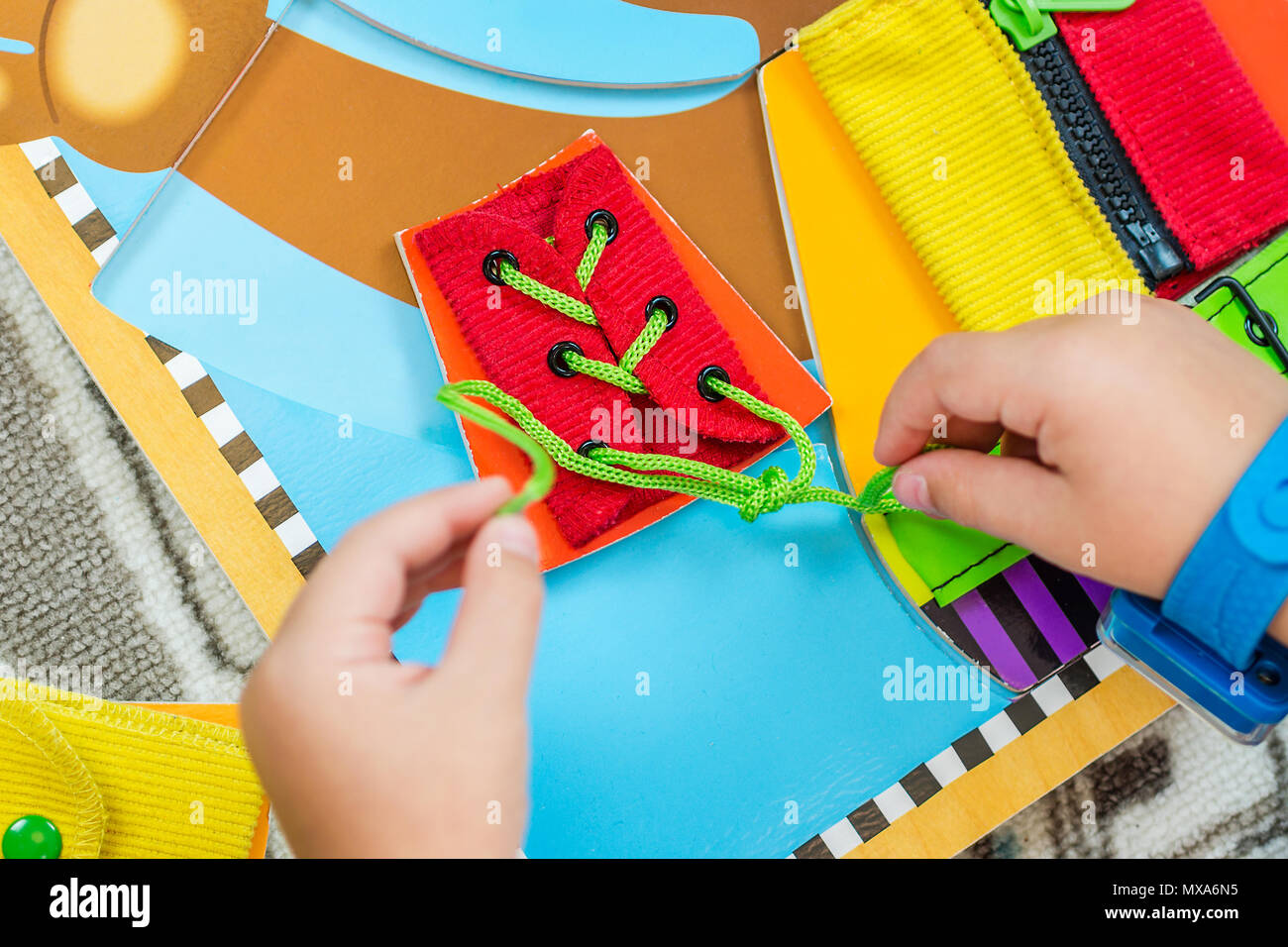 Learning to tie laces hi-res stock photography and images - Alamy