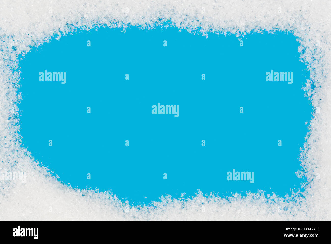 winter themed frame made of snow on blue backgound Stock Photo - Alamy