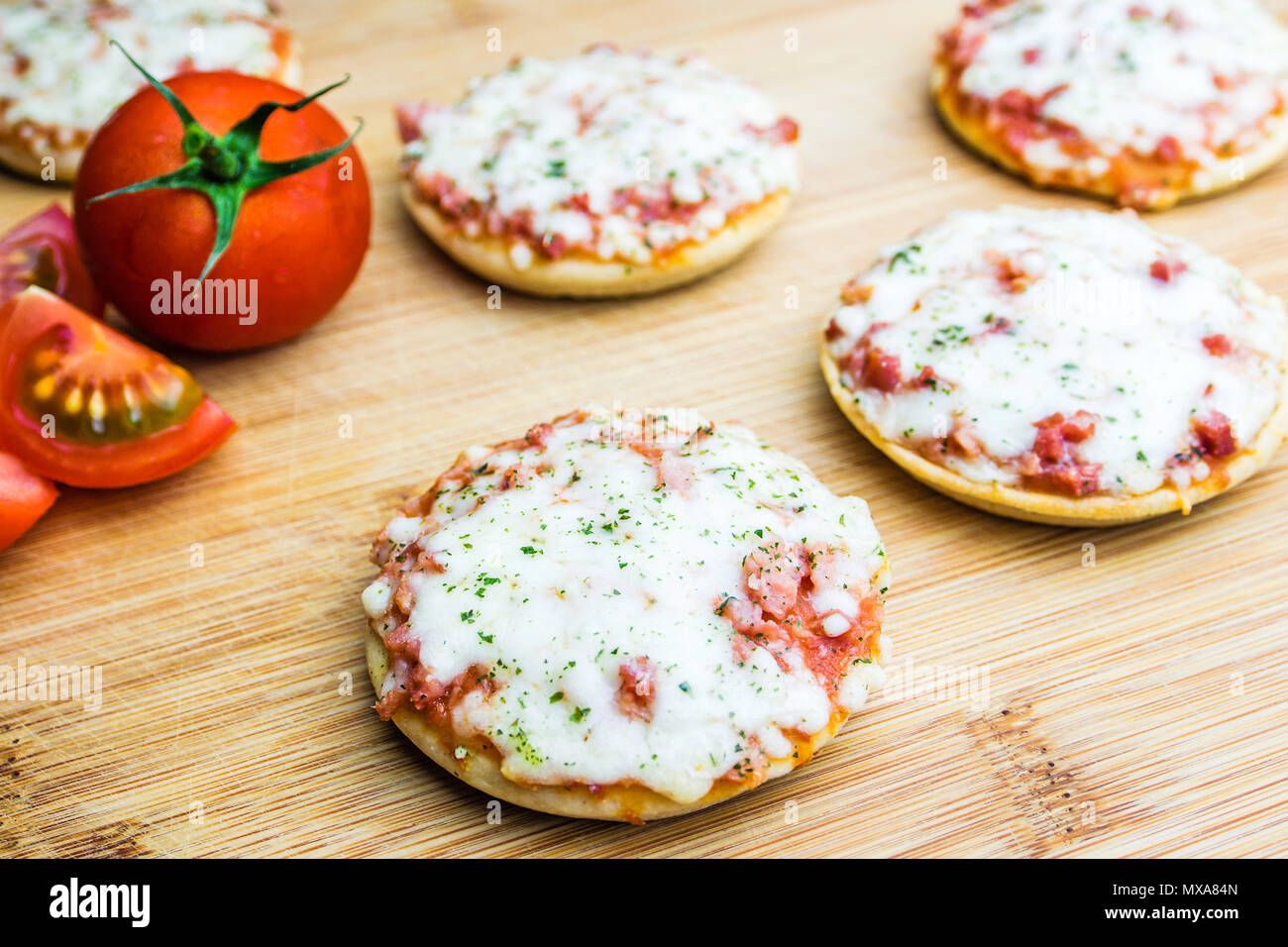 Mini pizzas snacks cheese hi-res stock photography and images - Alamy