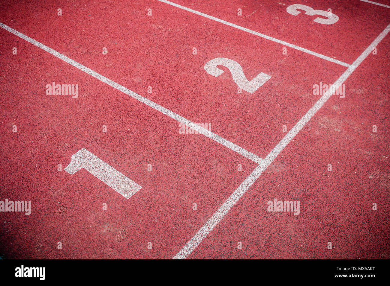 closeup of empty first three lines one on tartan running track Stock ...