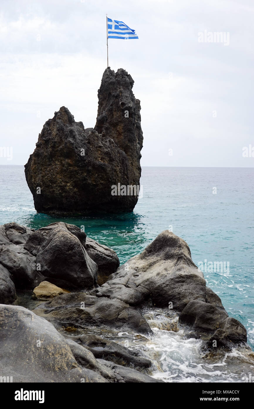 Greek flag on the rock near south coast of Crete, Greece Stock Photo ...